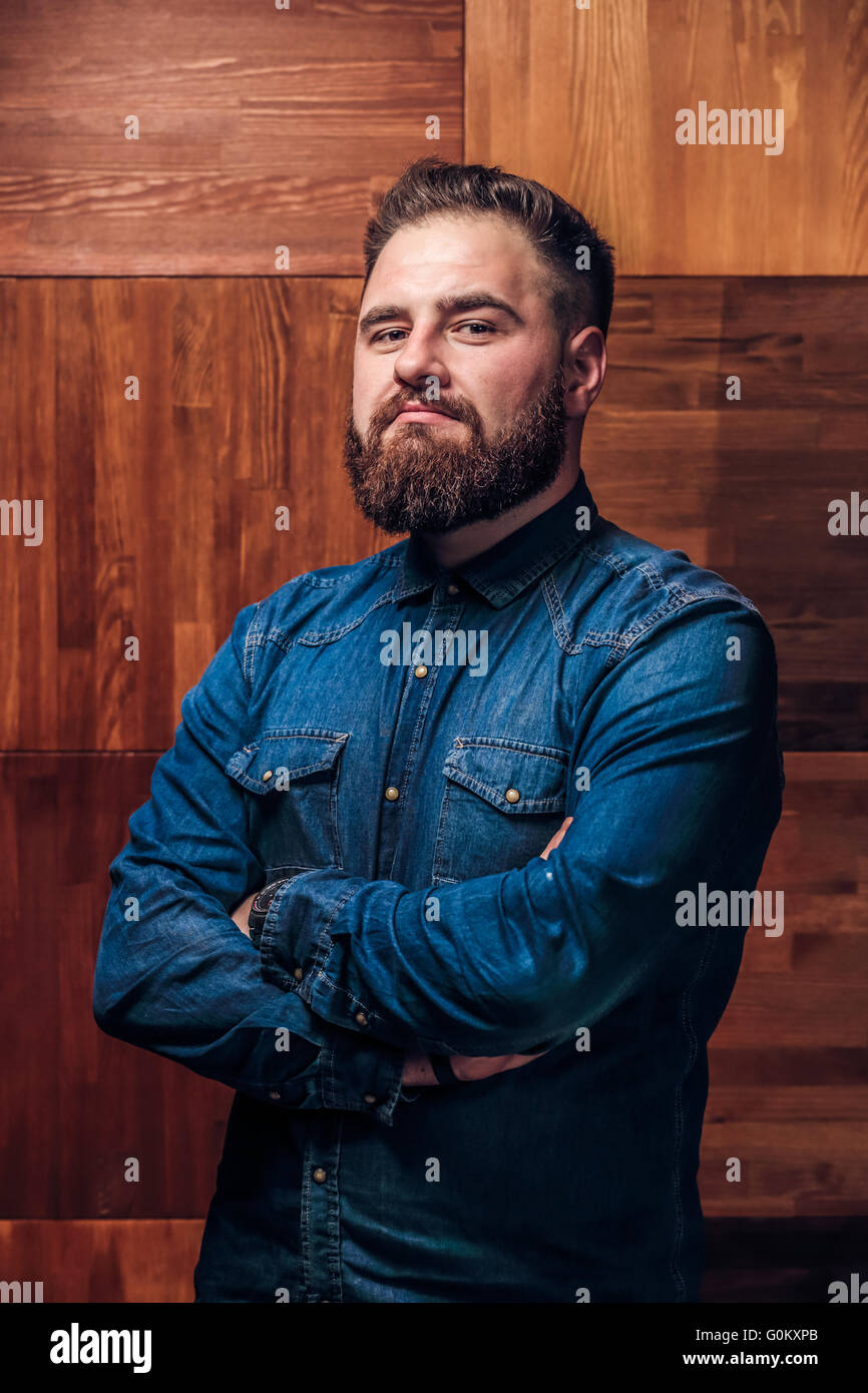 Happy man with beard after hairstyle in barbershop Stock Photo - Alamy