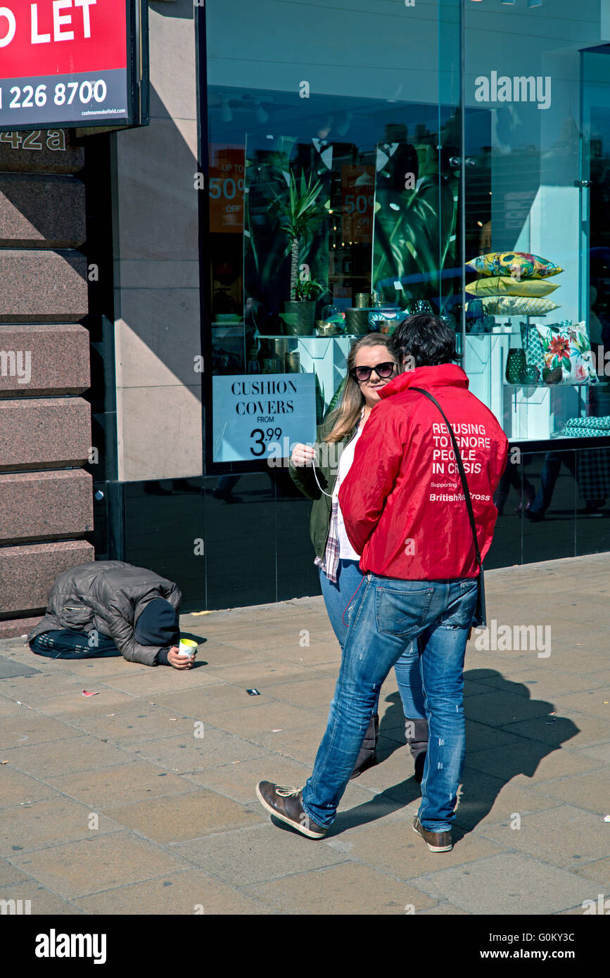 A charity worker, or chugger, working for British Red Cross confronts a ...