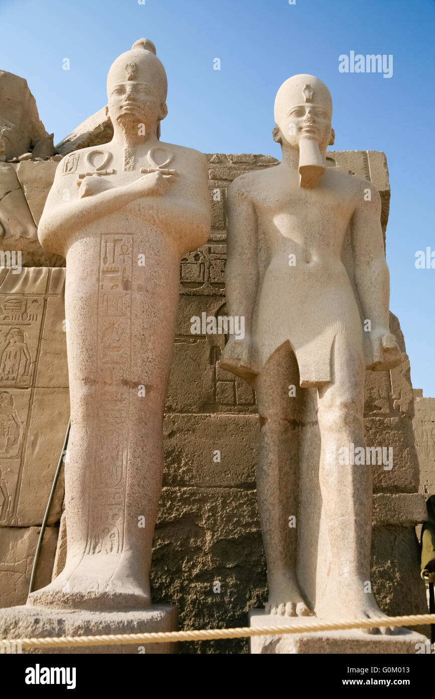 two statues sculptures of Egyptian pharaoh king in landmark Temple of ...