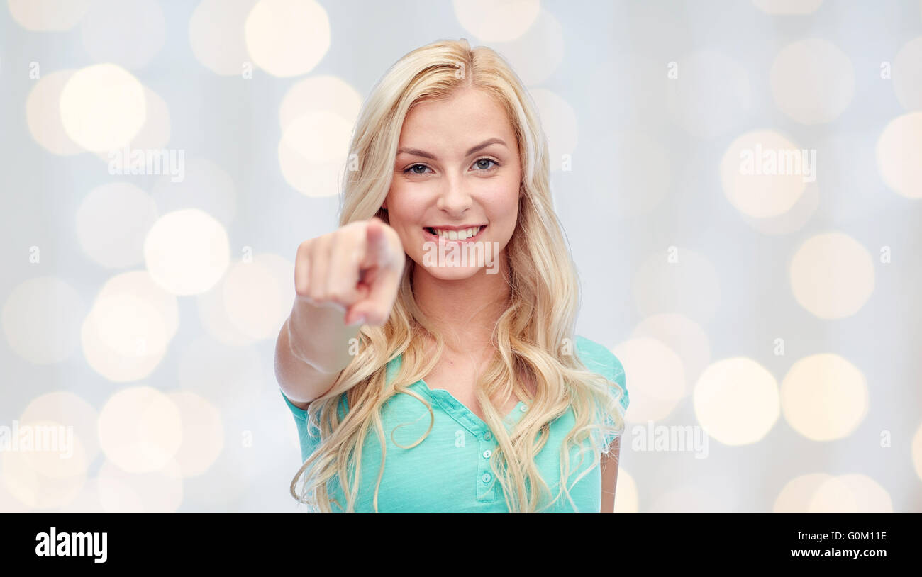 happy young woman pointing finger to you Stock Photo - Alamy