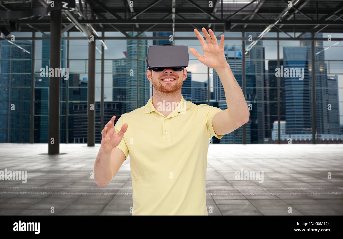 happy man in virtual reality headset or 3d glasses Stock Photo - Alamy