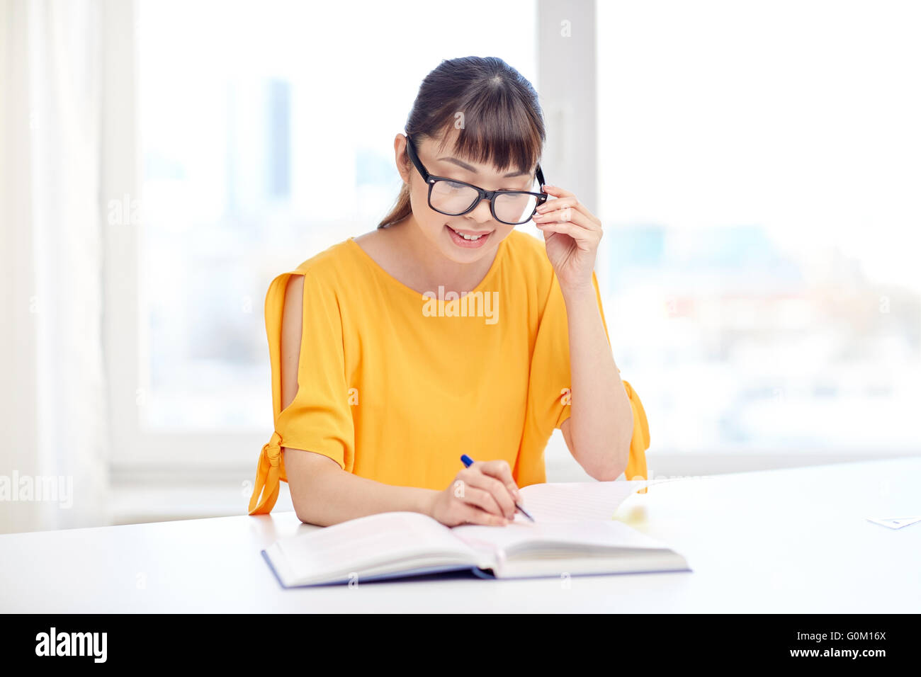 happy asian young woman student learning at home Stock Photo - Alamy