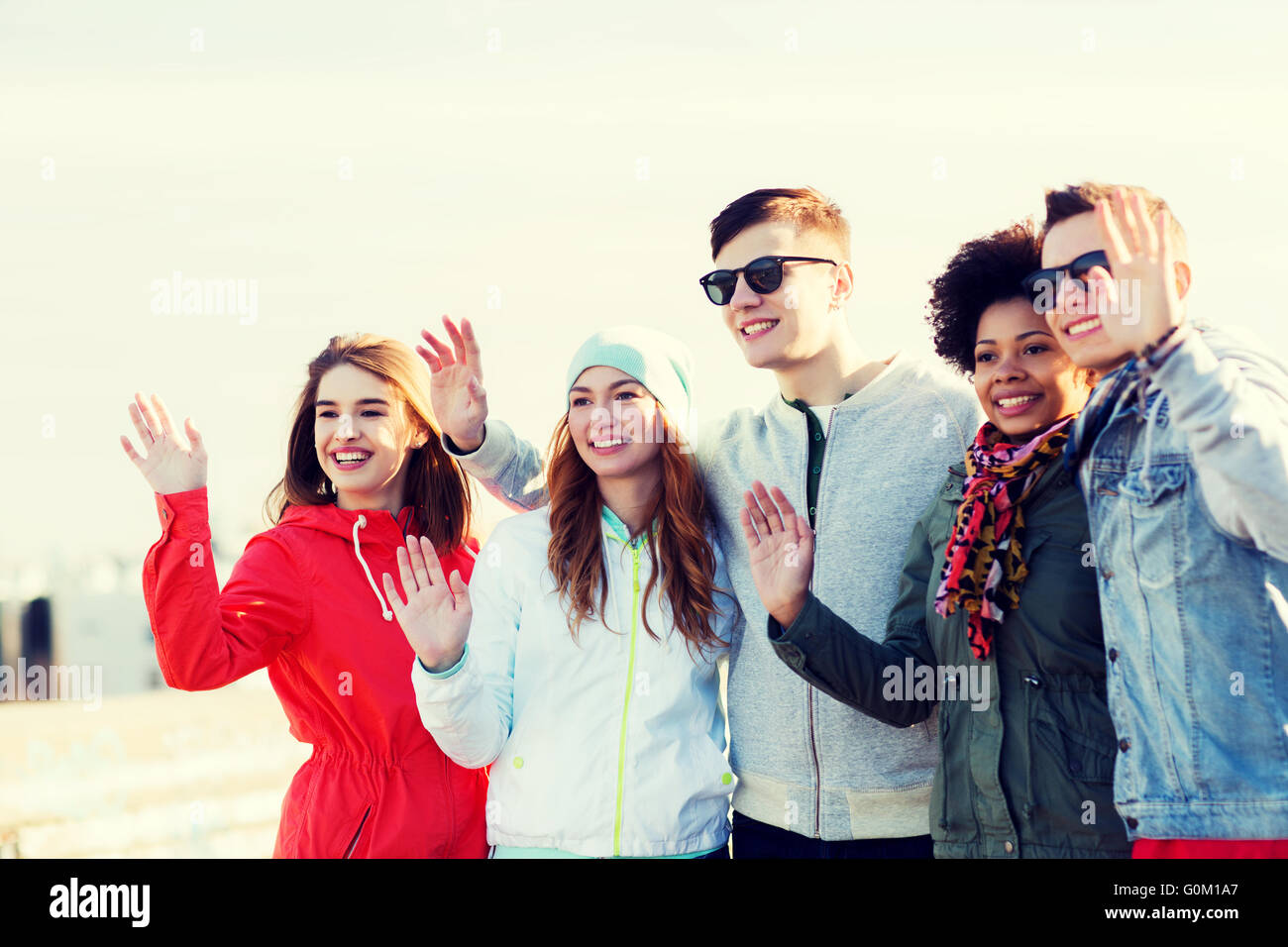 Teenager girl waving friend hi-res stock photography and images - Alamy