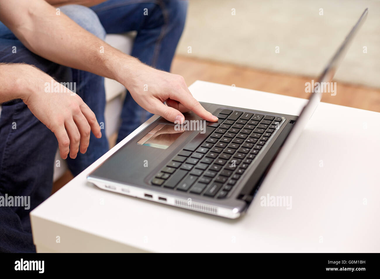 close up of male hands with laptop at home Stock Photo - Alamy