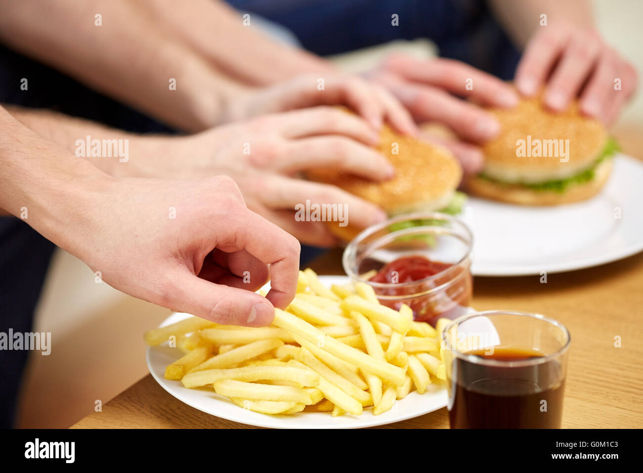 Concept junk food hands hi-res stock photography and images - Alamy
