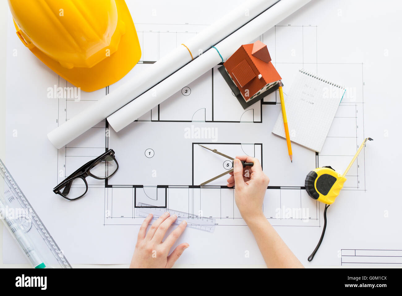 close up of hands with compass measuring blueprint Stock Photo - Alamy