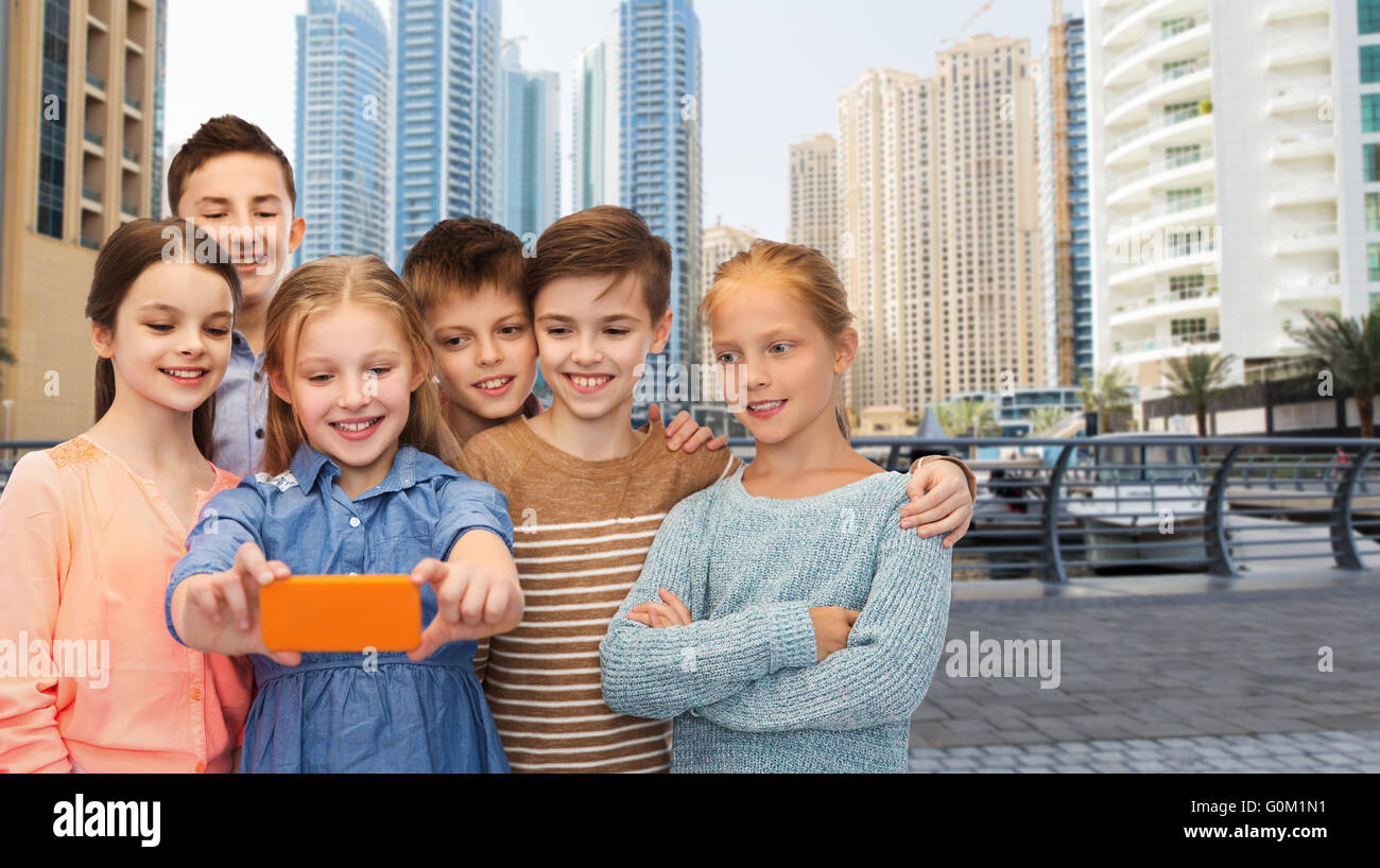 happy children talking selfie by smartphone Stock Photo - Alamy