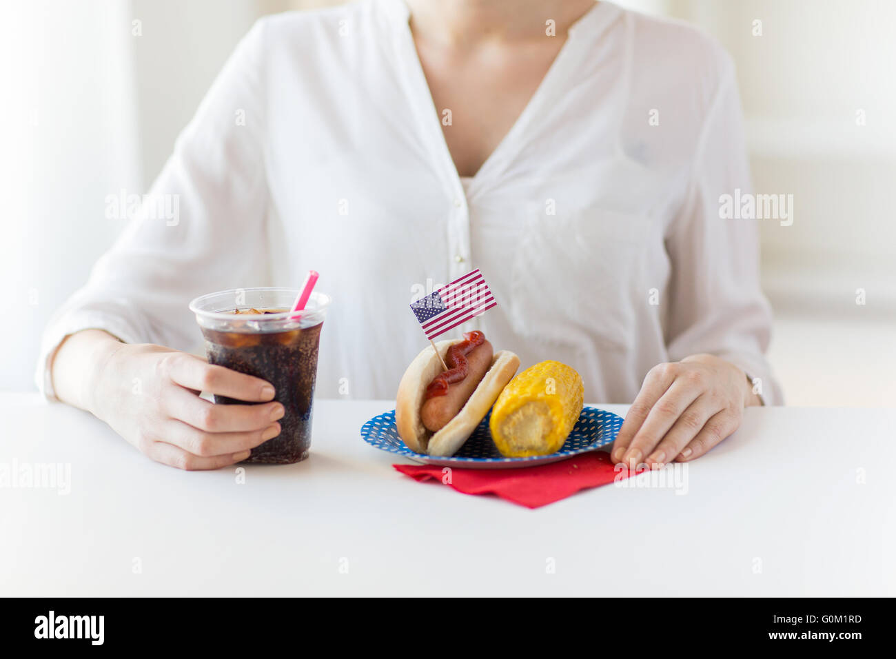 Woman eating corn dog hi-res stock photography and images - Alamy