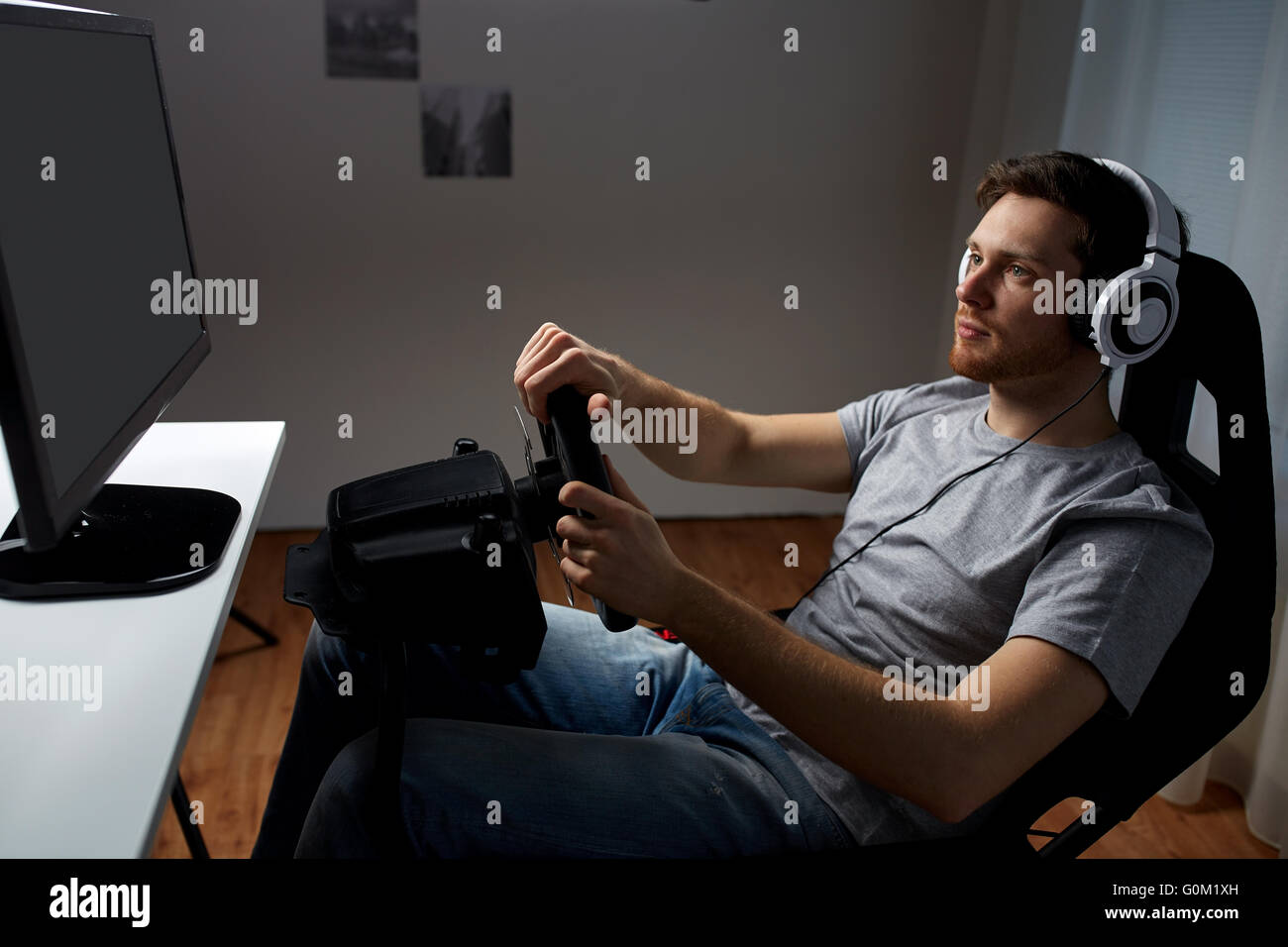 man playing car racing video game at home Stock Photo - Alamy