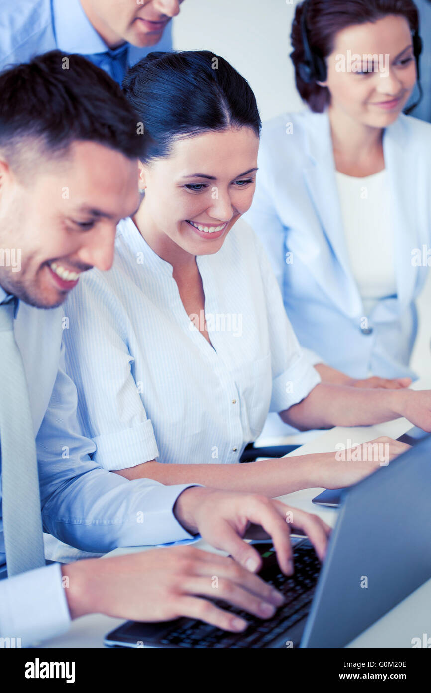 group of people working with laptops in office Stock Photo - Alamy