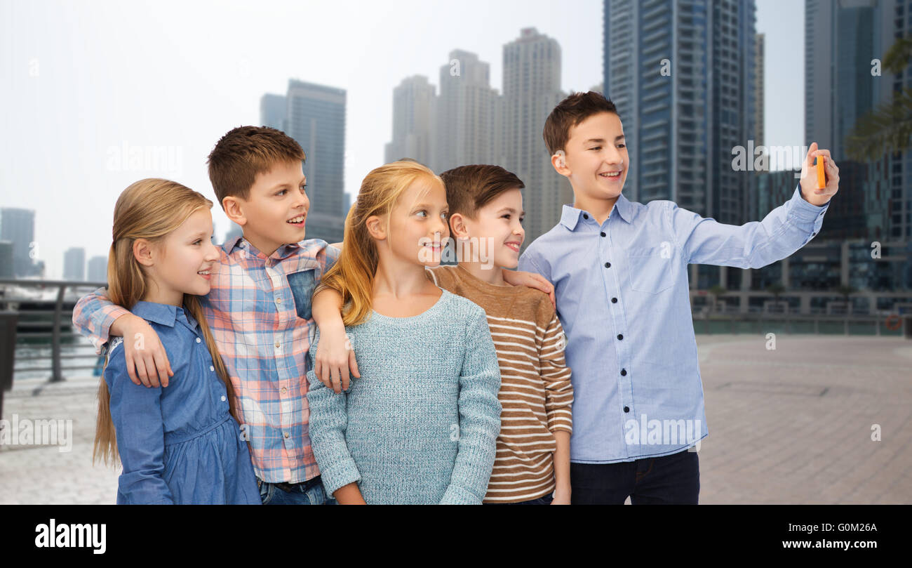 happy children talking selfie by smartphone Stock Photo - Alamy