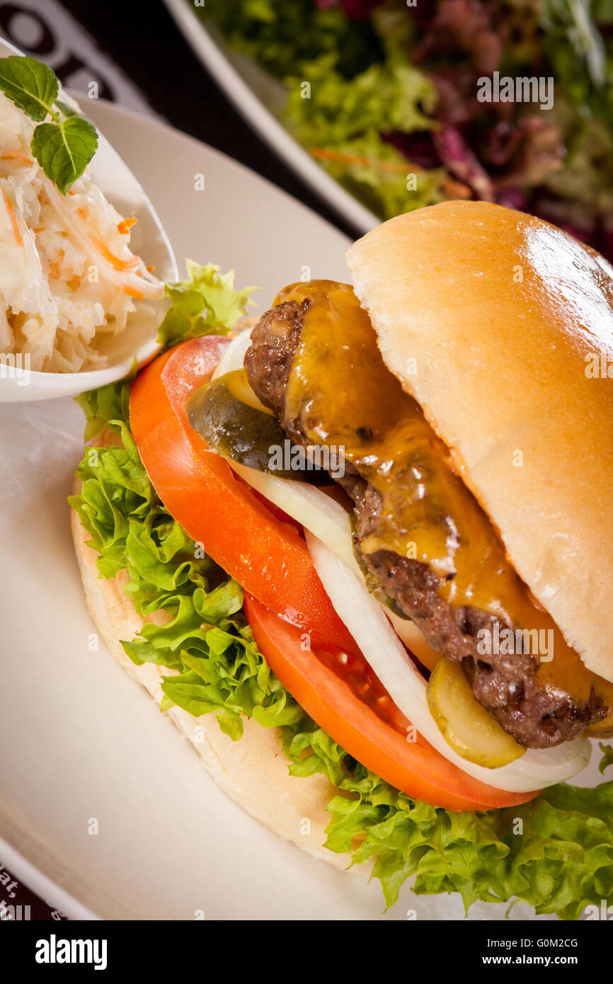 Cheeseburger with cole slaw Stock Photo - Alamy
