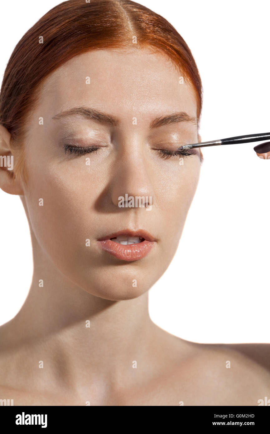 Pretty Woman Applying Eye Shadow Makeup Stock Photo - Alamy