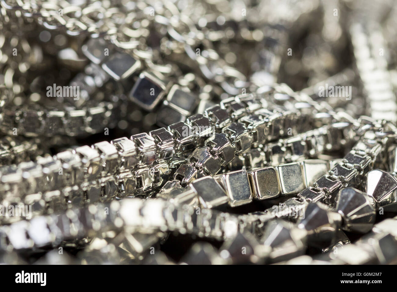 Silver chain pile closeup hi-res stock photography and images - Alamy