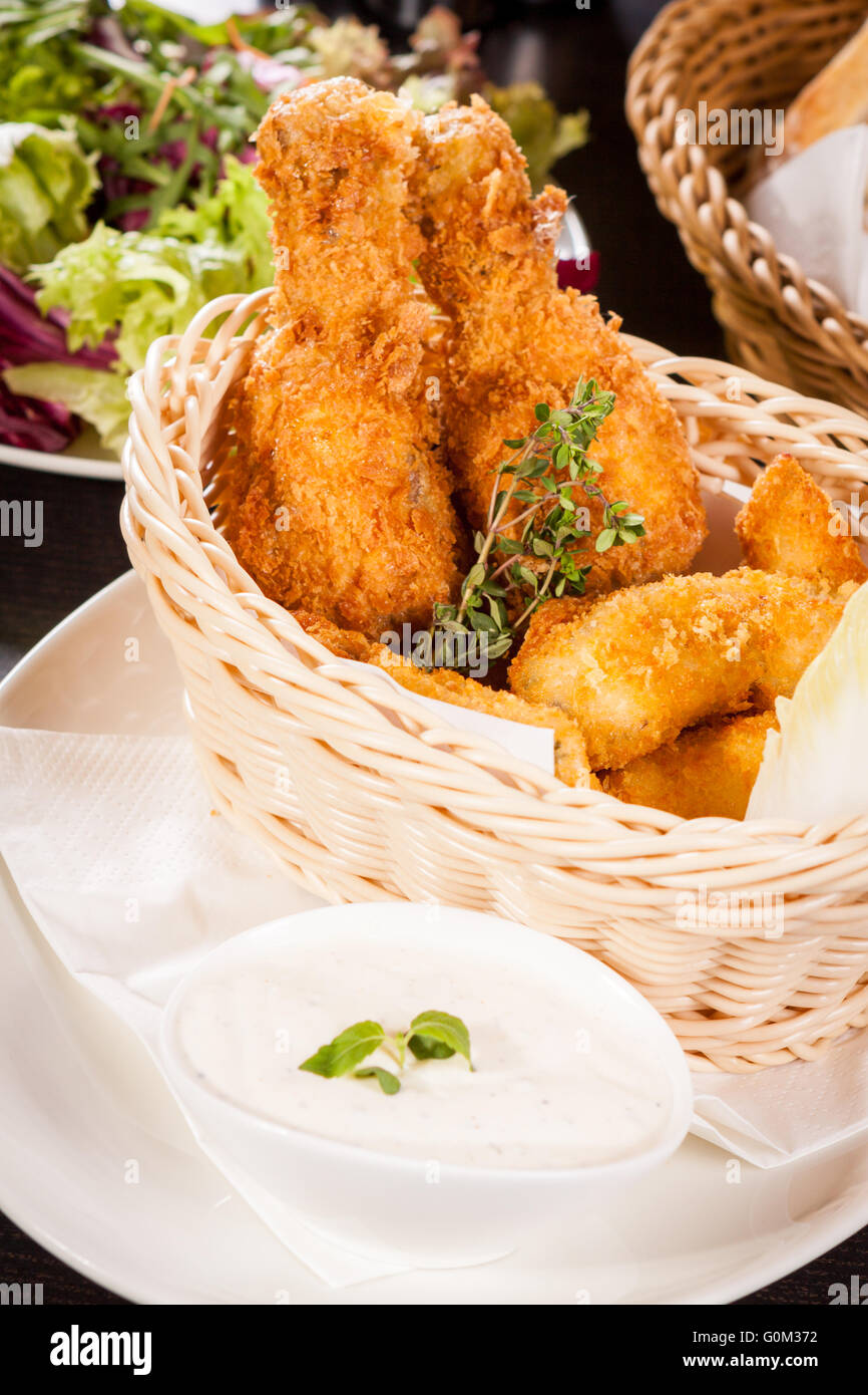 Crisp crunchy golden chicken legs and wings Stock Photo - Alamy