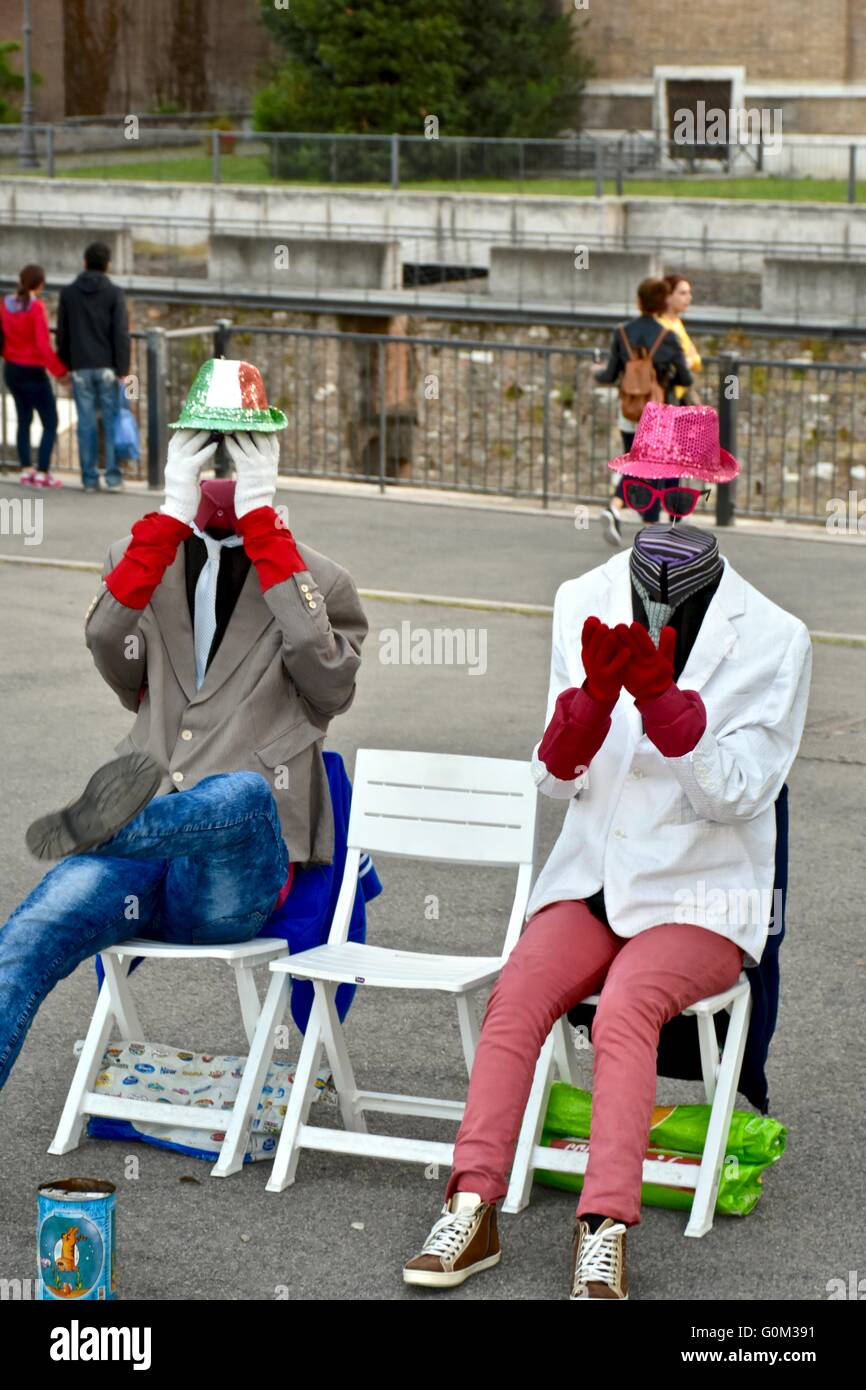 Two mimes hiding their faces while performing acts in Rome Stock Photo ...
