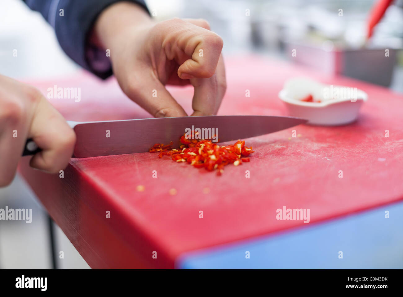 Chef cutting red hot chili hi-res stock photography and images - Alamy