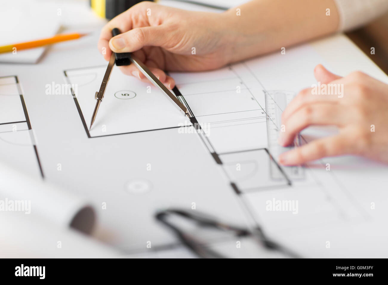 close up of hands with compass measuring blueprint Stock Photo - Alamy