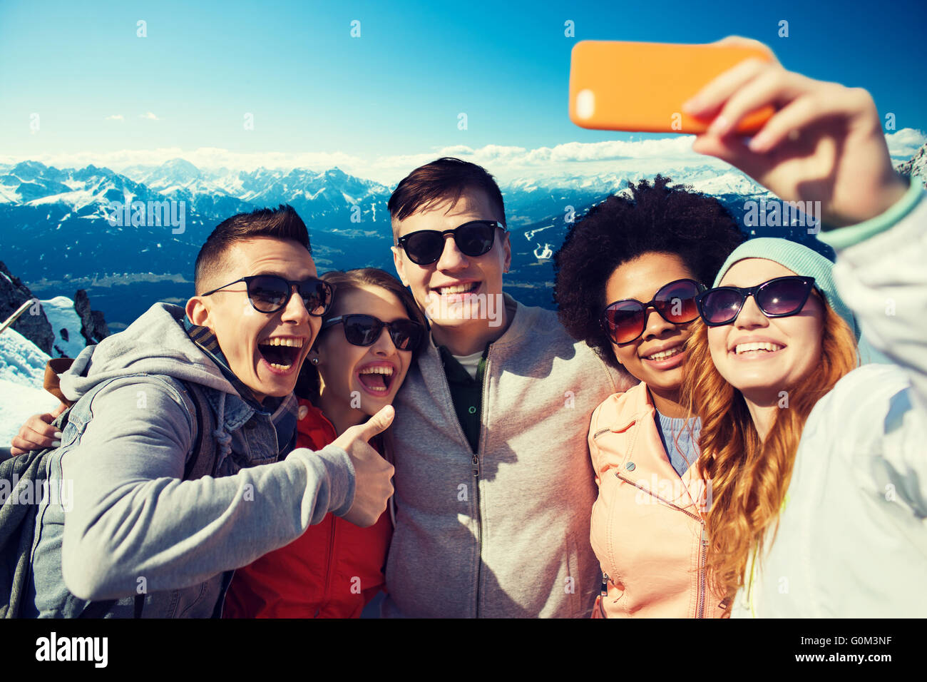 smiling friends taking selfie with smartphone Stock Photo - Alamy