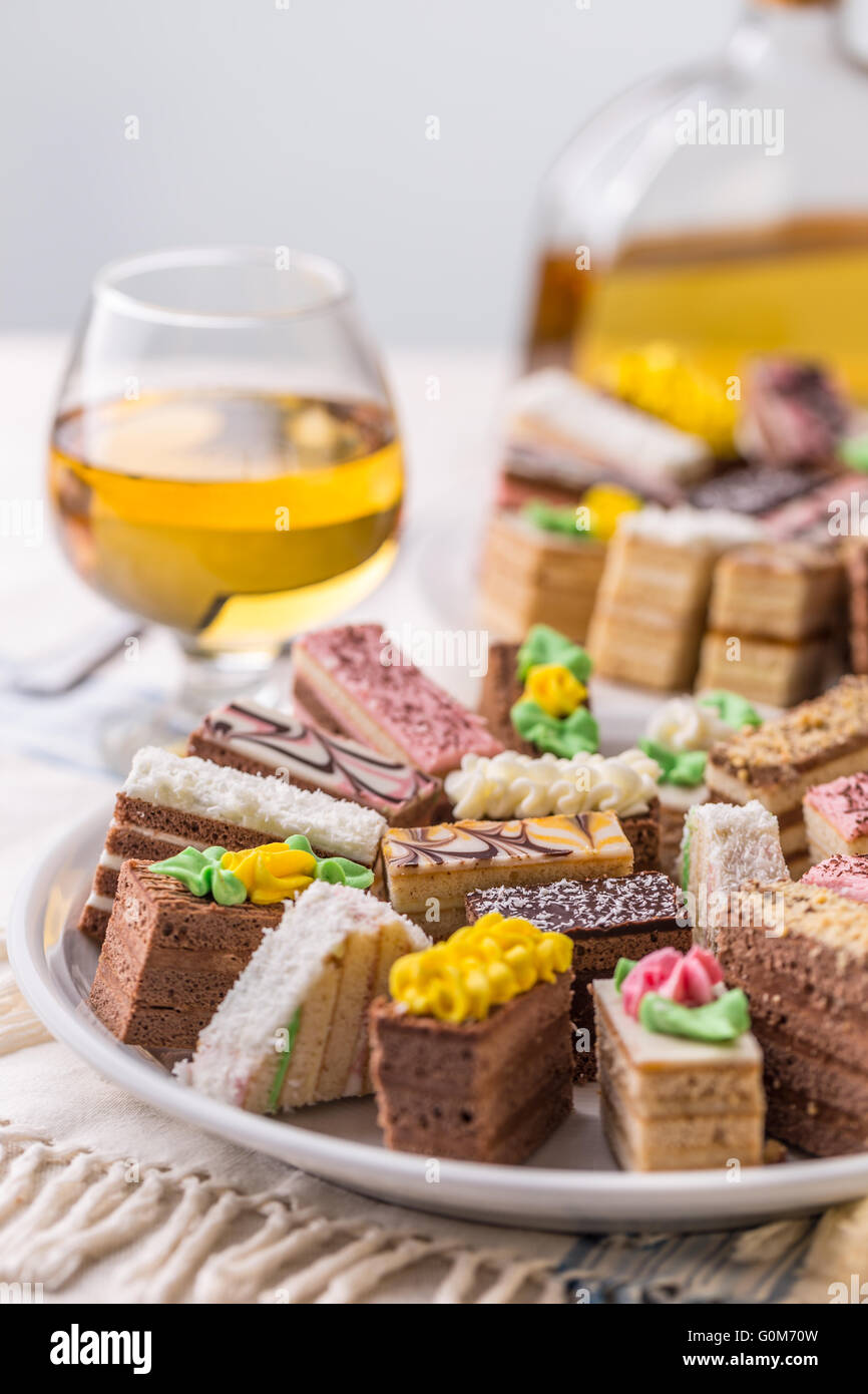 Assorted different mini cakes with cream Stock Photo - Alamy