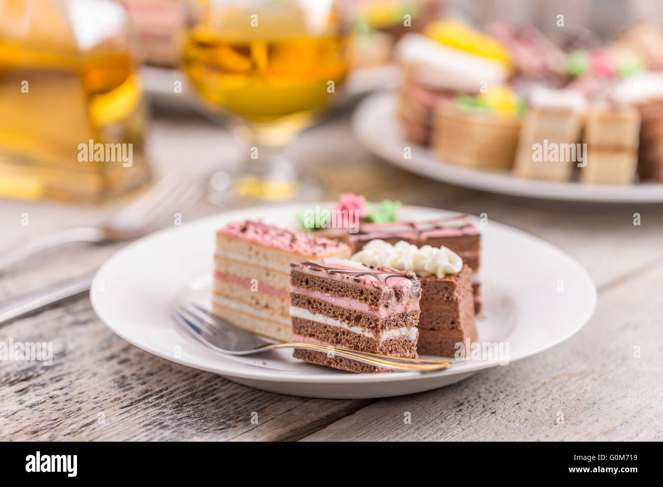 Assorted different mini cakes with cream Stock Photo - Alamy