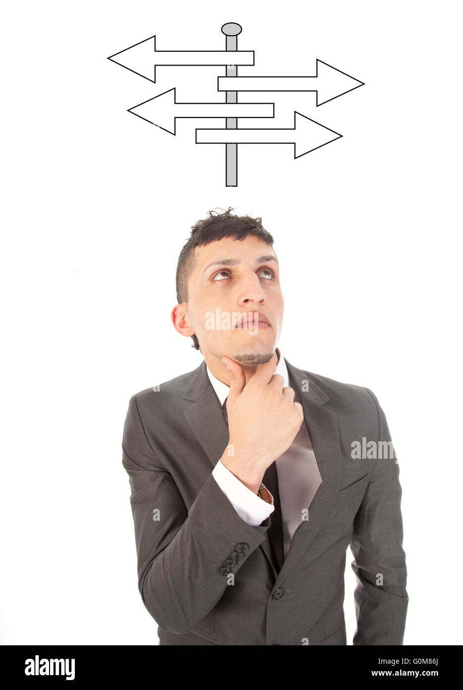 Young man making a choice with arrows isolated on white background ...