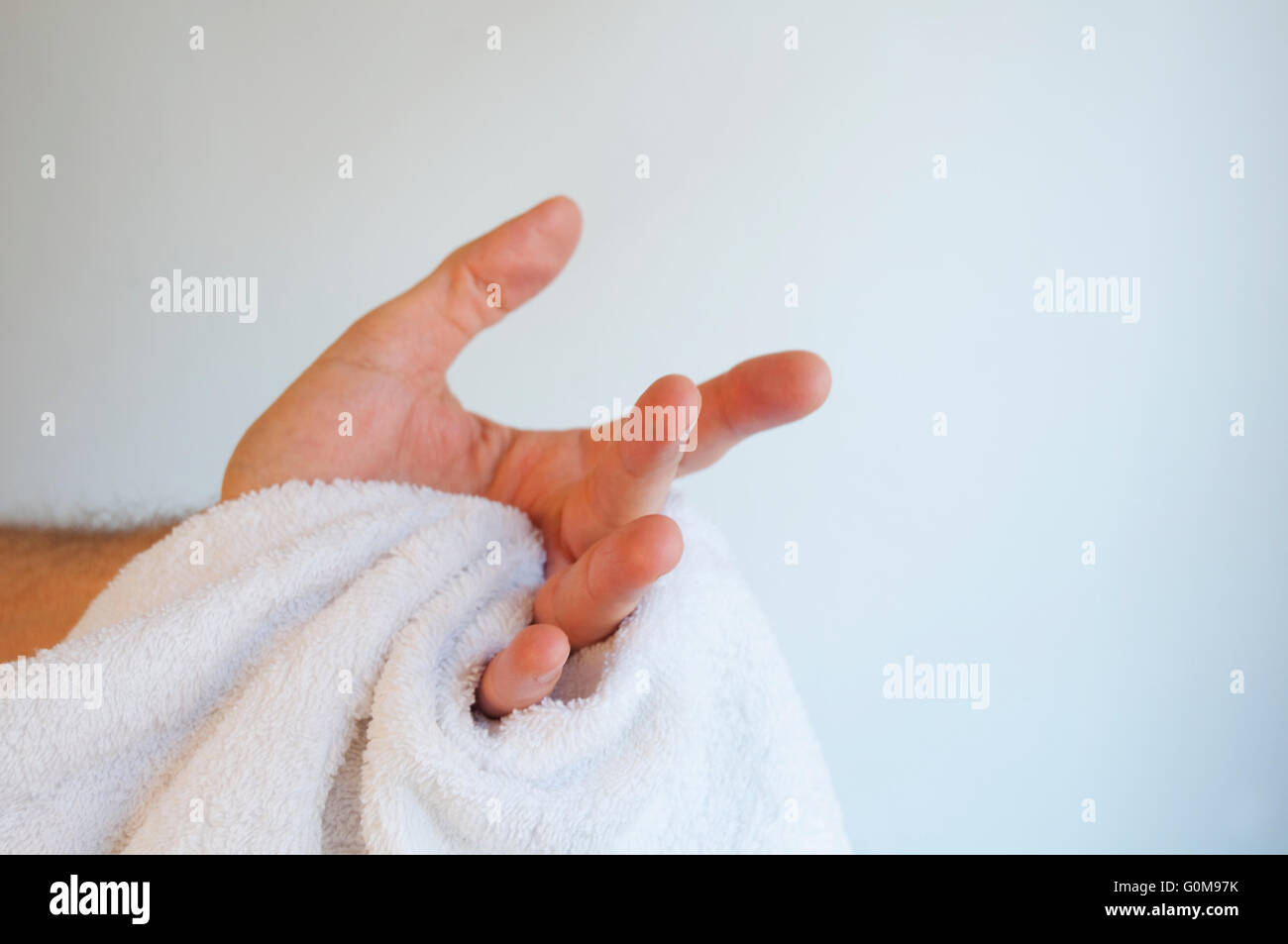 Man drying his hands with the towel. Close view Stock Photo - Alamy