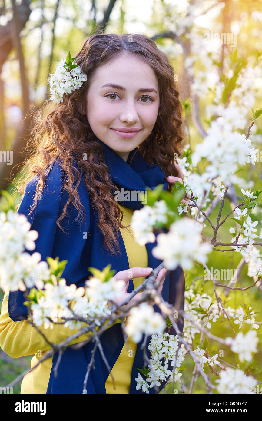 Portrait of young beautiful woman in spring blossom trees Stock Photo ...