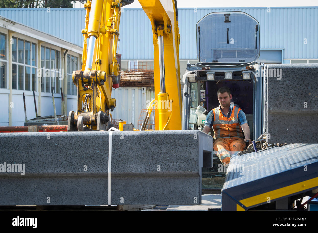 A man operating an excavator Stock Photo - Alamy