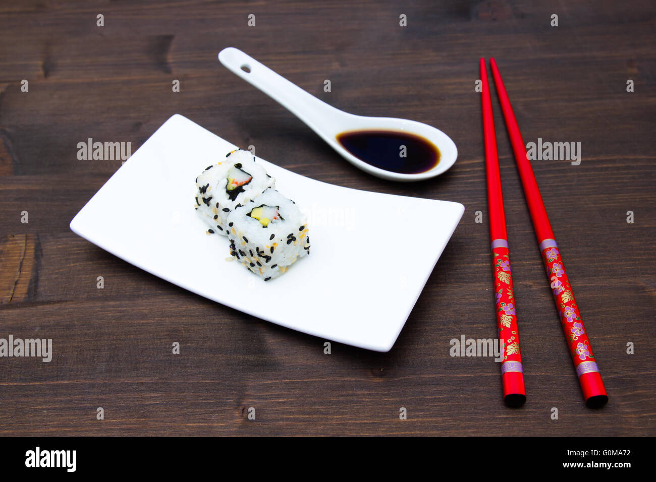 California roll with avocado and surimi on wood table Stock Photo - Alamy