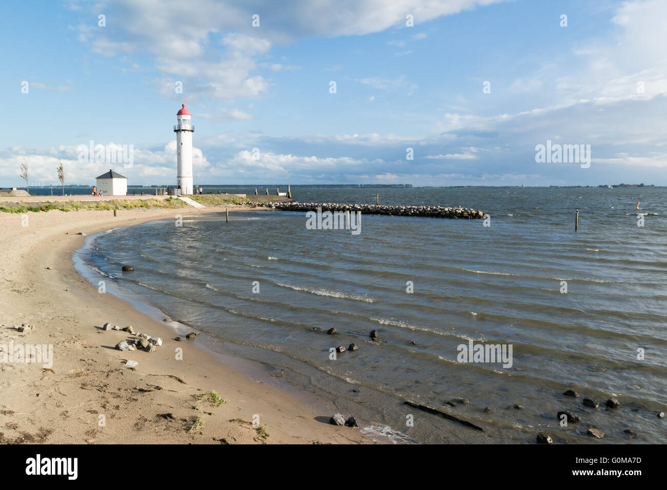 Haringvliet canal, lighthouse and beach of Hellevoetsluis on Voorne ...