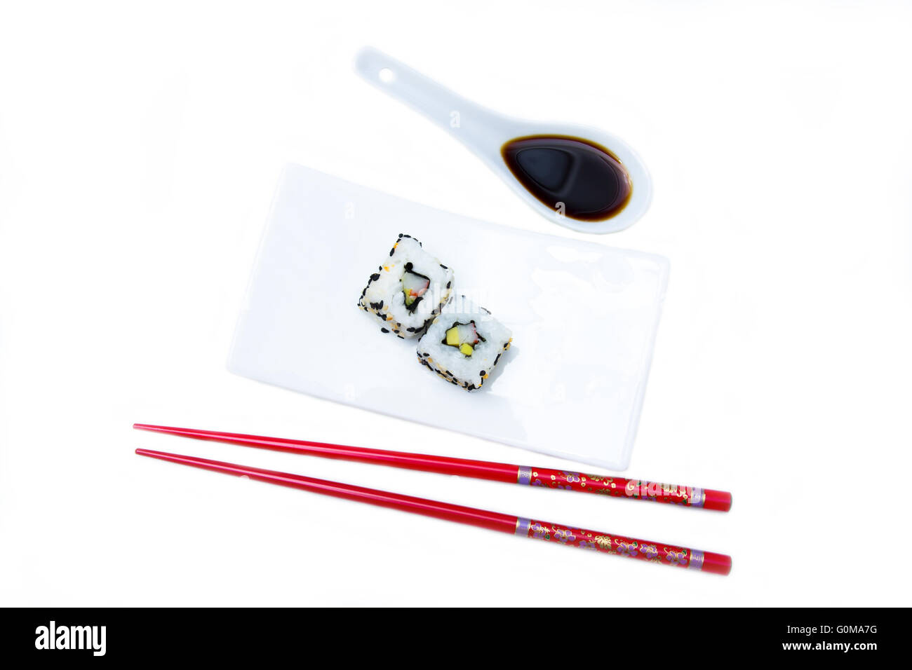 California roll with avocado and surimi on a white background seen from ...