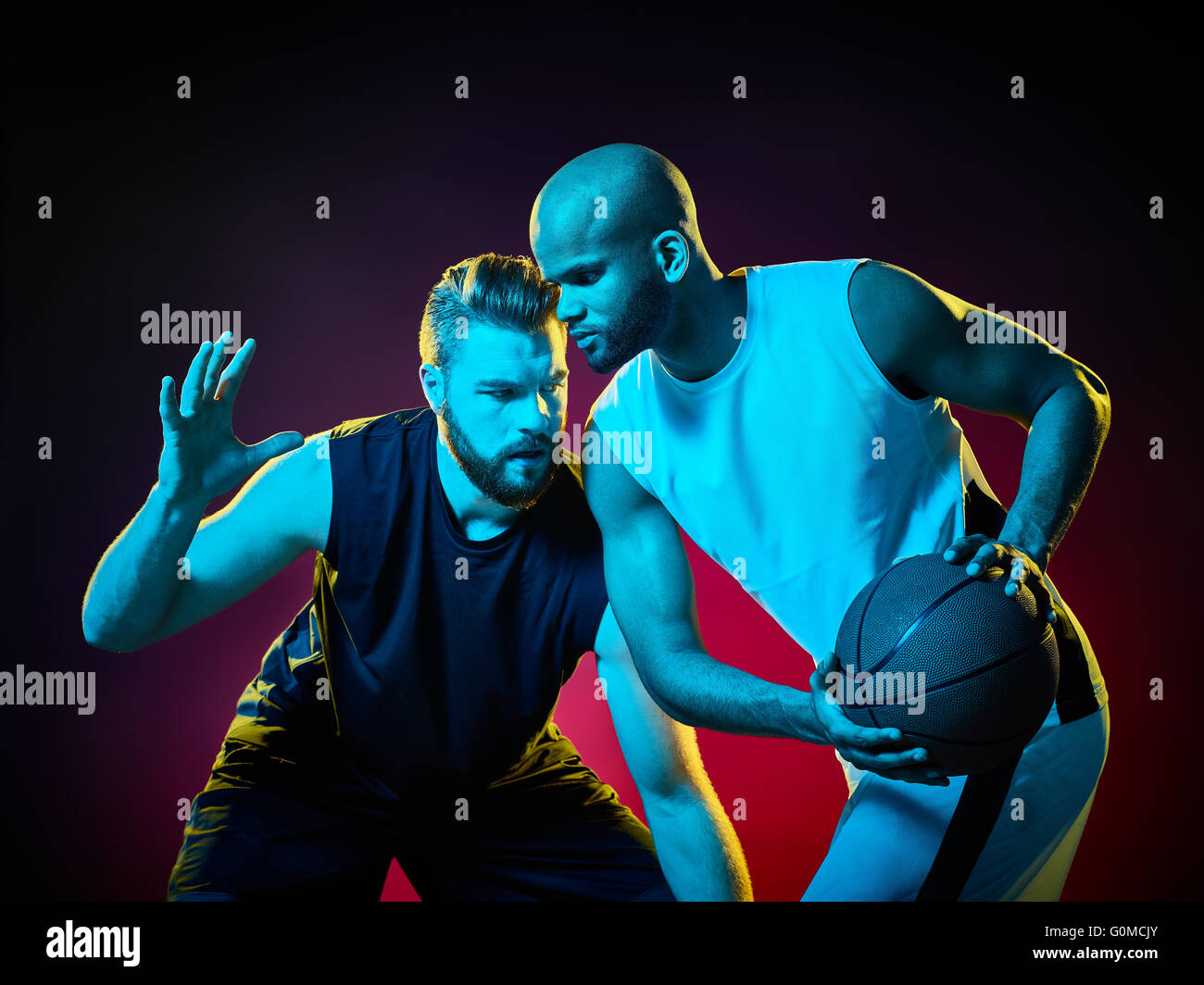 two basketball players men Isolated on black background Stock Photo - Alamy