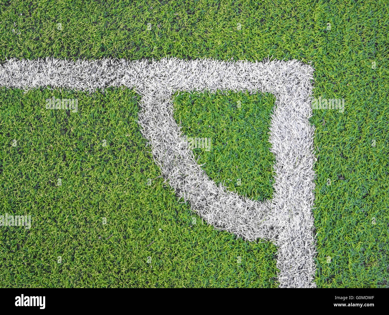 Conner of football field with white line Stock Photo - Alamy