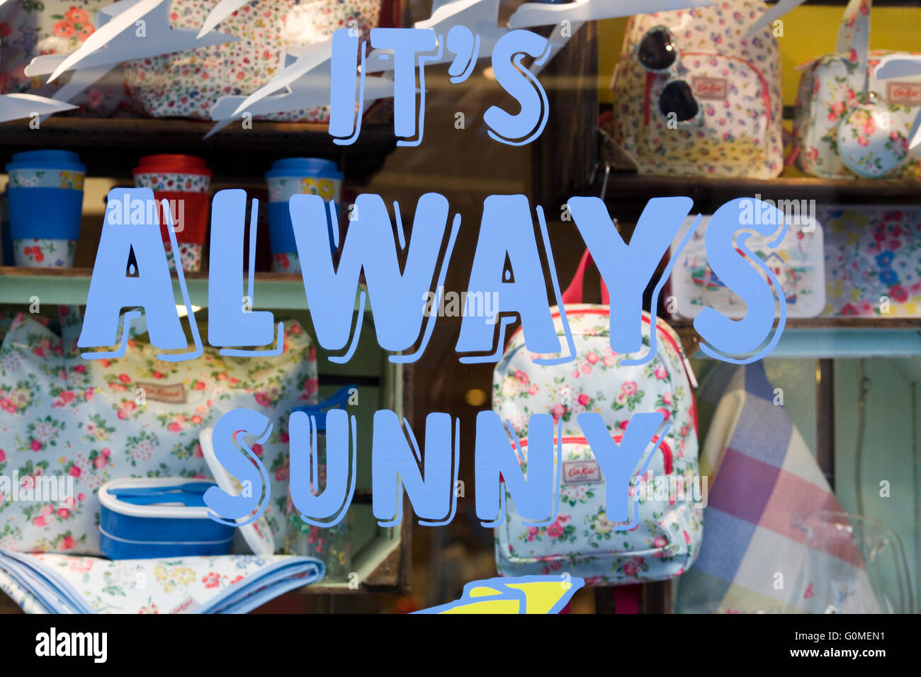 Shop window displaying "It's always sunny Stock Photo - Alamy