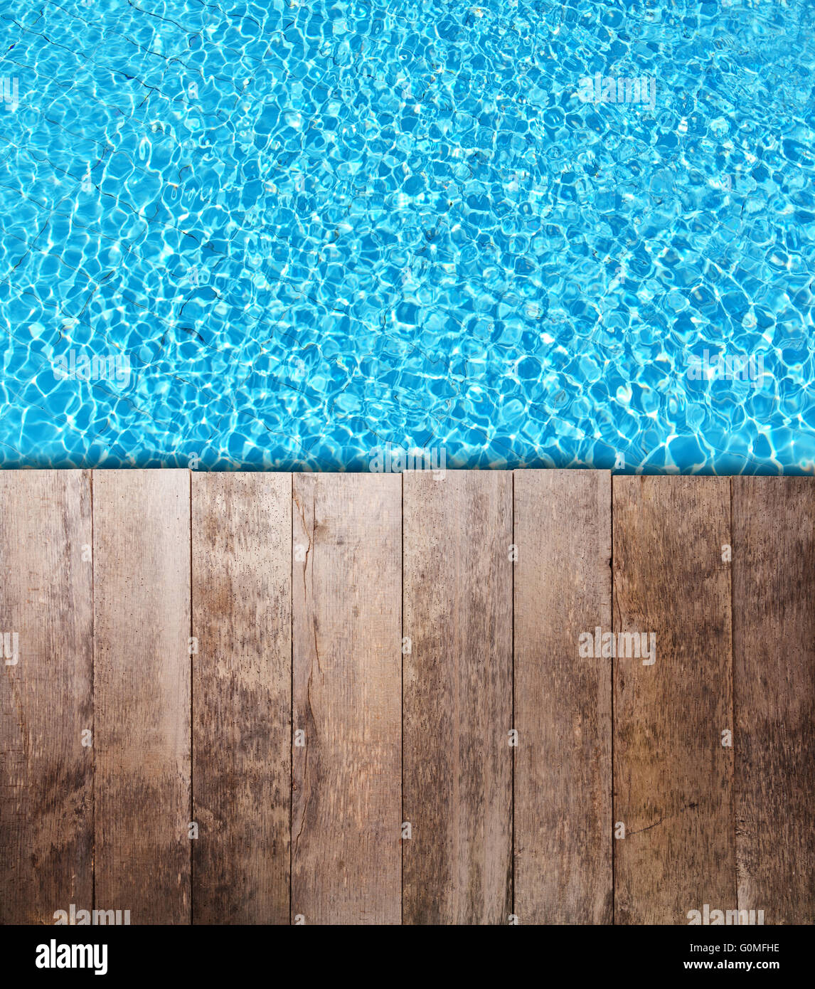 Old wooden planks placedover swimming pool surface. Ideal for copyspace ...