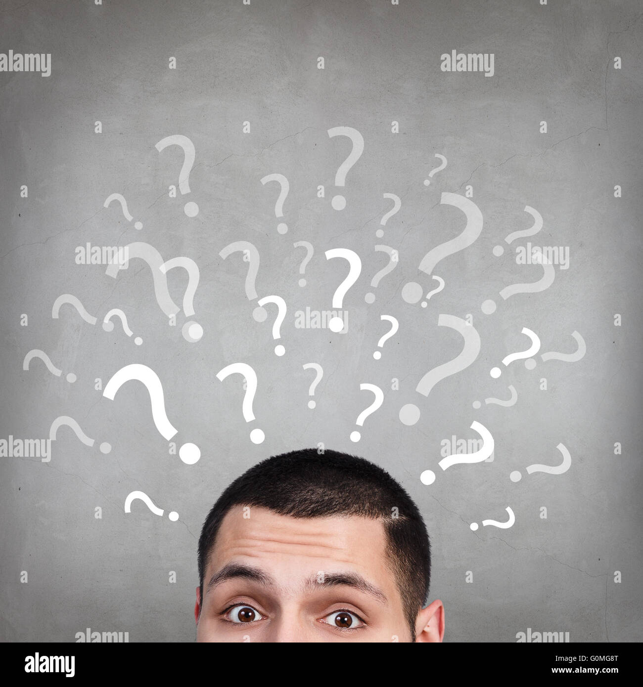 Handsome man has too many questions Stock Photo - Alamy