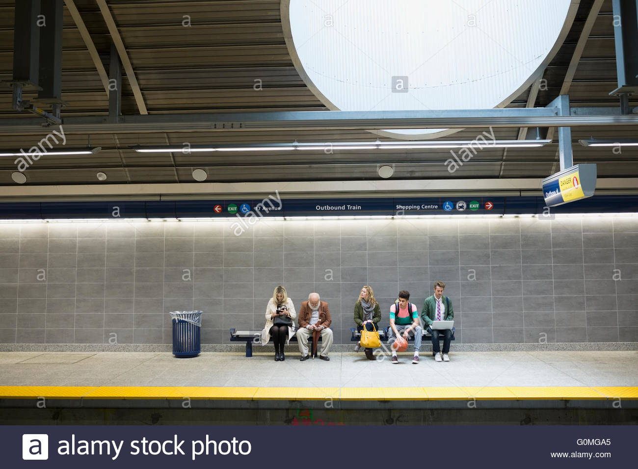 People waiting on station hi-res stock photography and images - Alamy