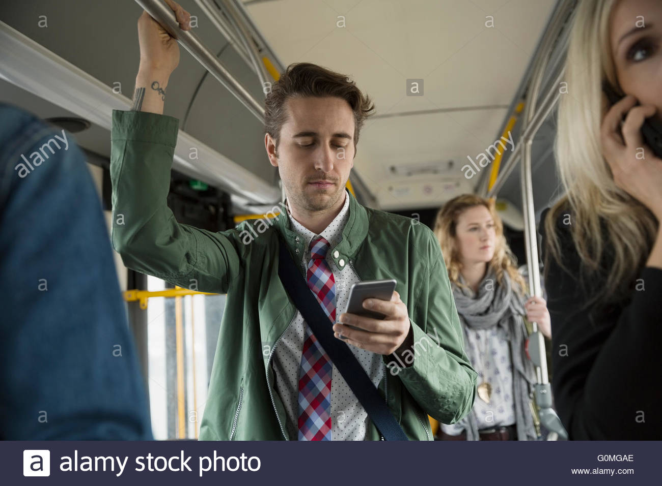 Standing on bus hi-res stock photography and images - Alamy