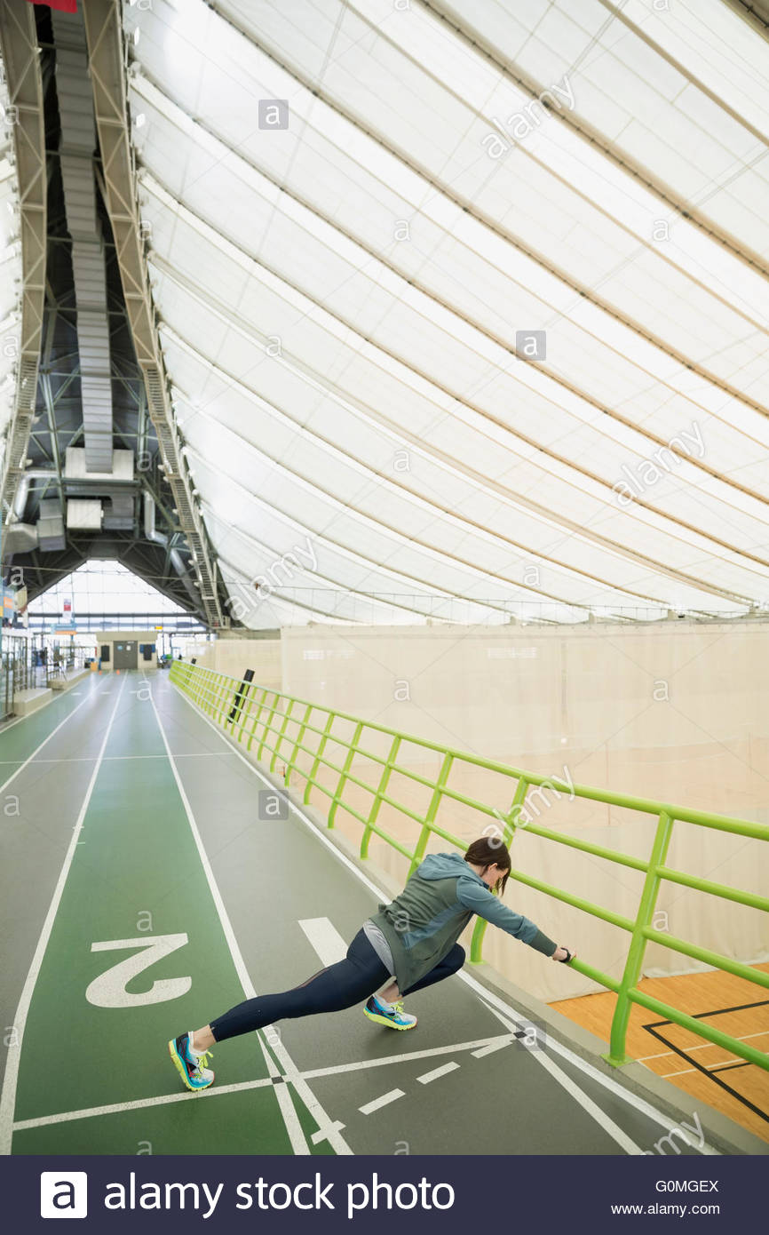 Track runner stretching hi-res stock photography and images - Alamy