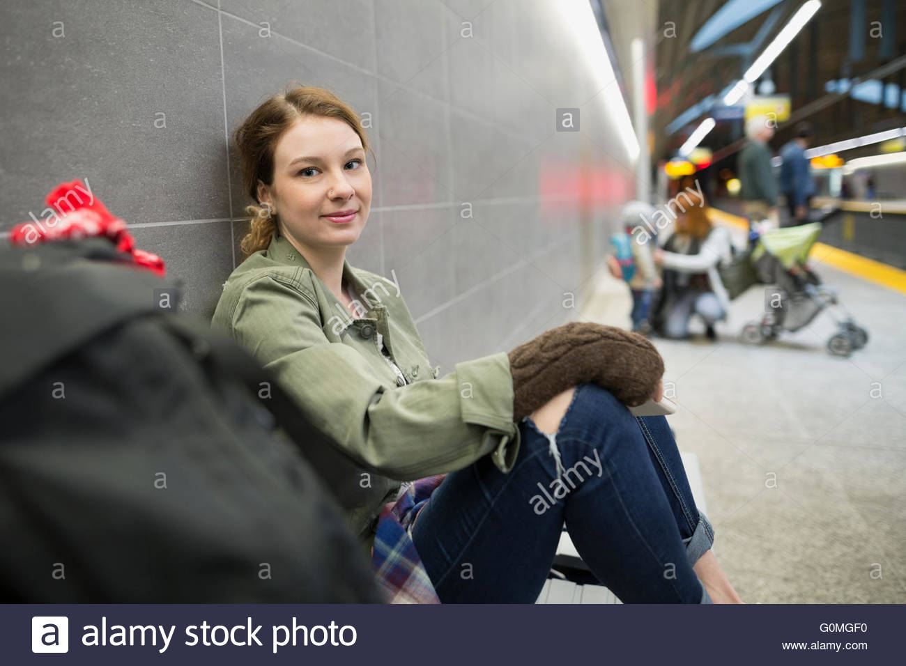 Portrait smiling young woman waiting subway station platform Stock ...