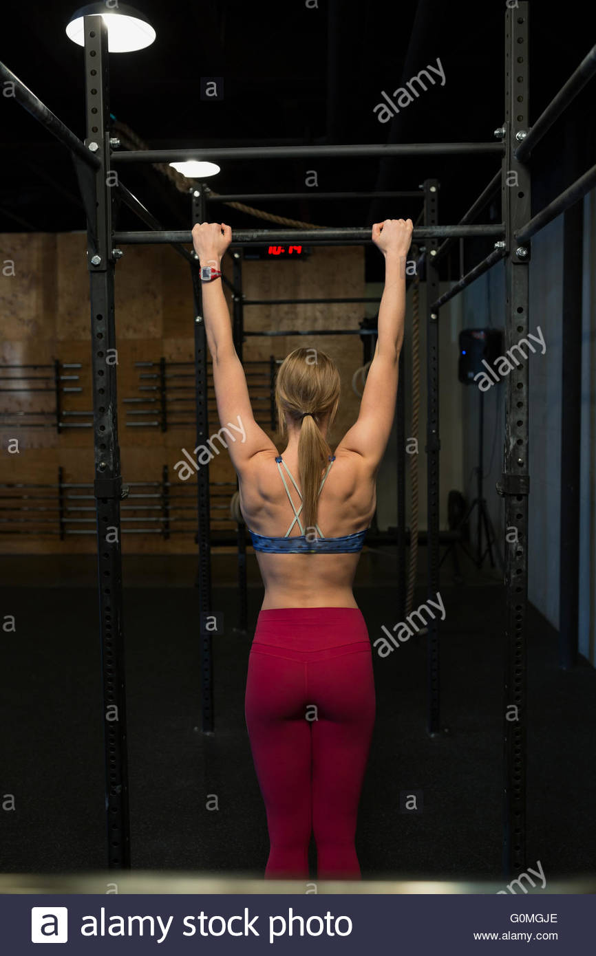 Fitness girl doing pull ups hi-res stock photography and images - Alamy