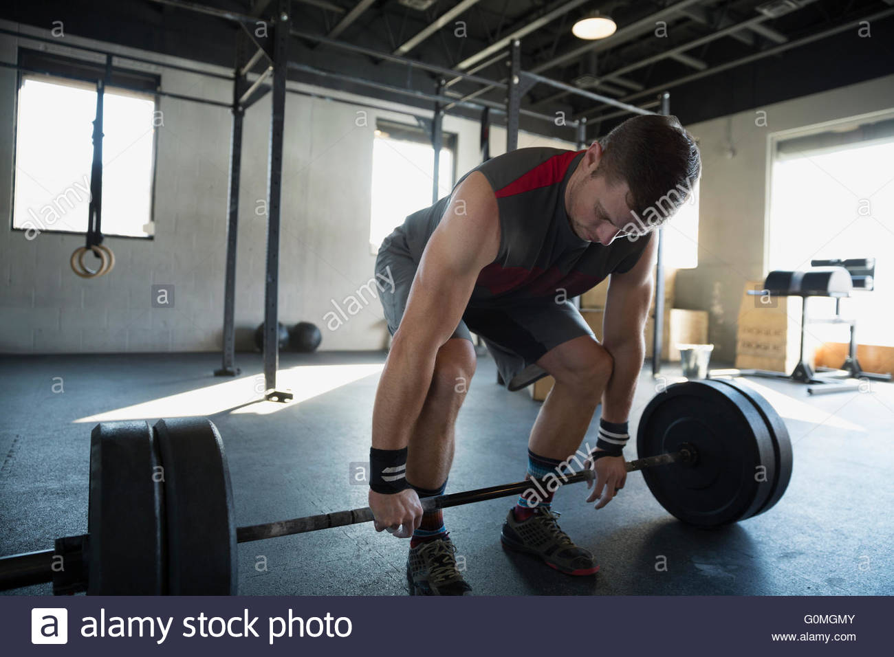 Full length squatting hi-res stock photography and images - Alamy
