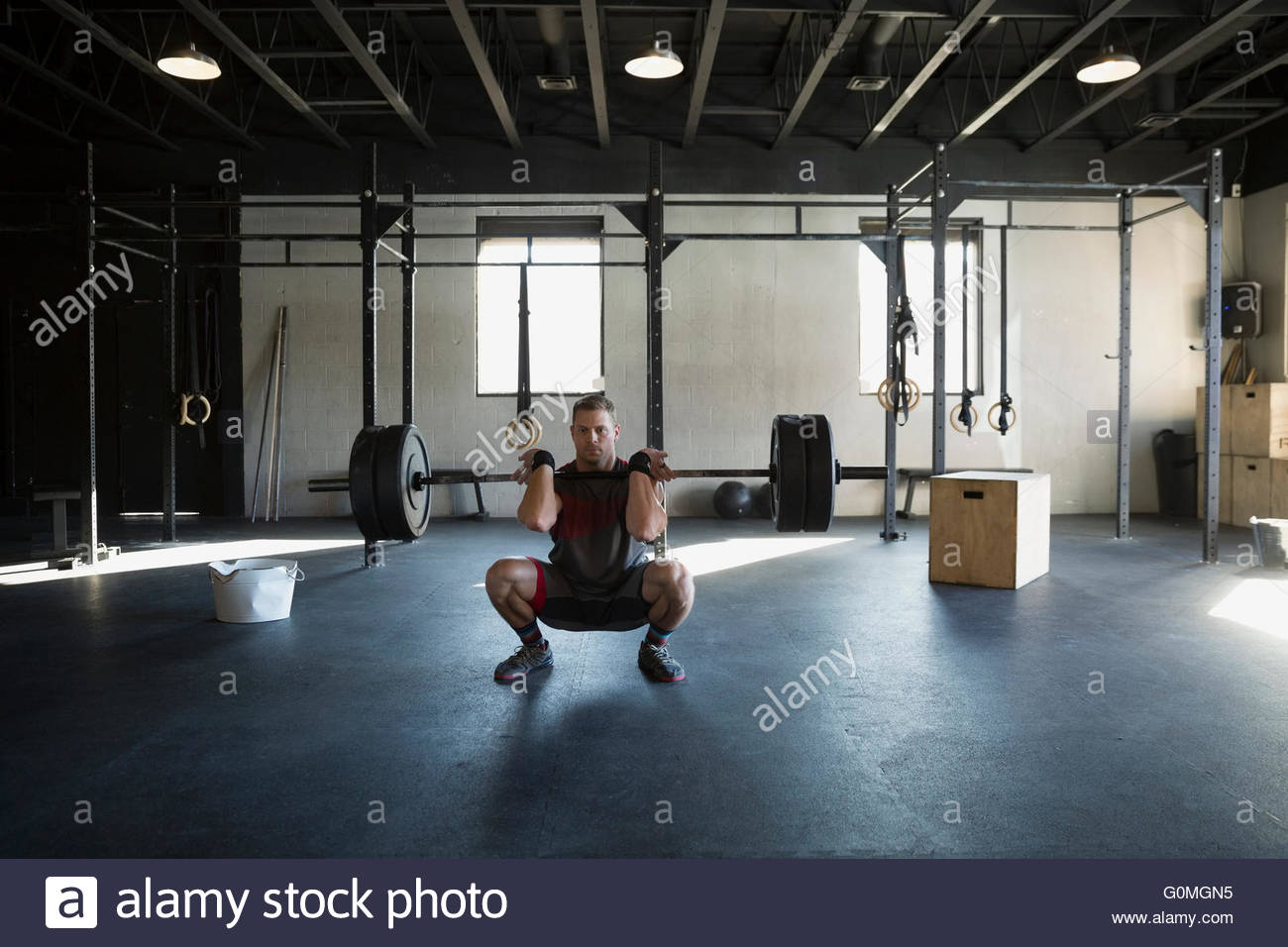 Full length squatting hi-res stock photography and images - Alamy