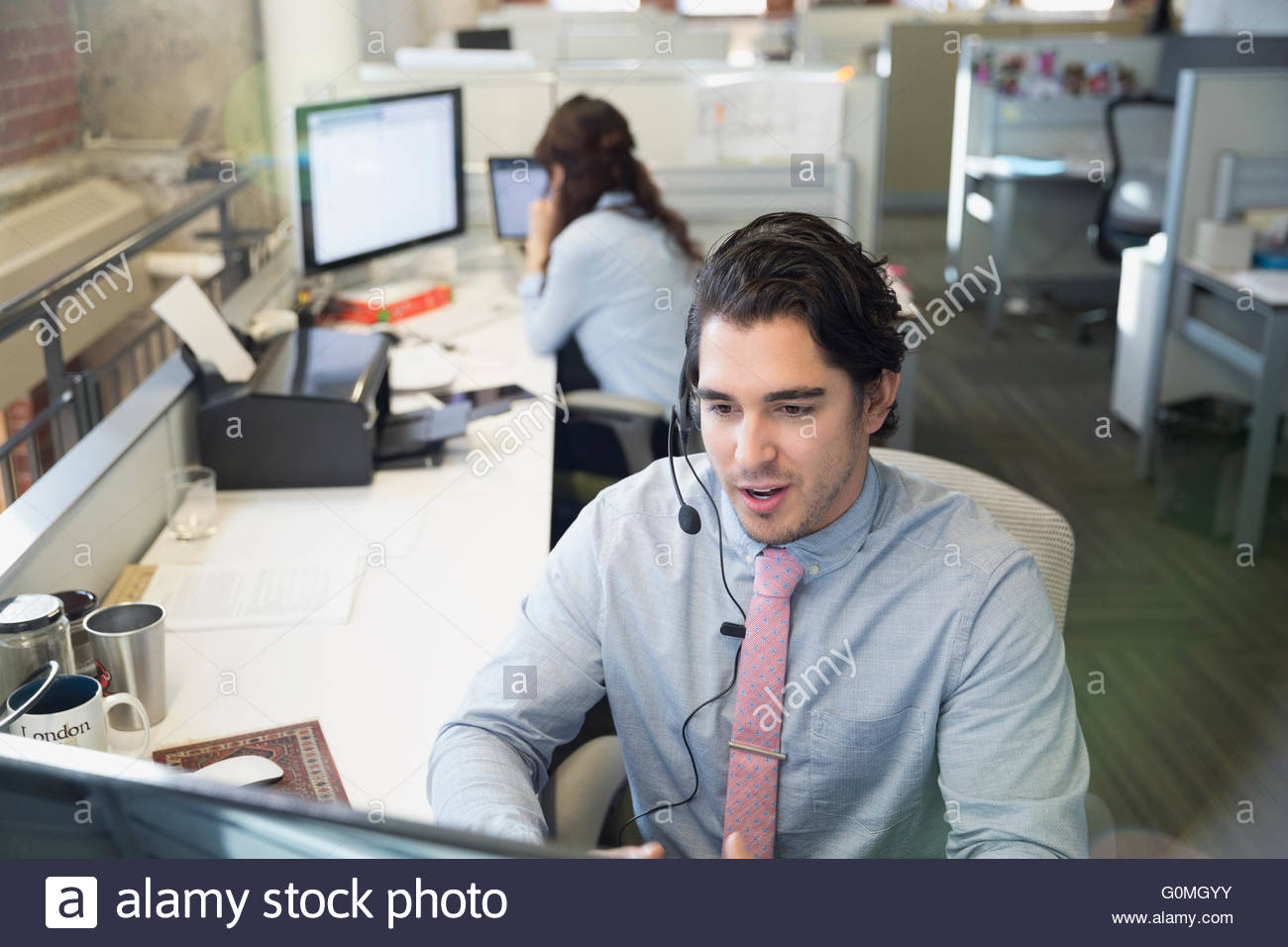 Man wearing headset in computer hi-res stock photography and images - Alamy
