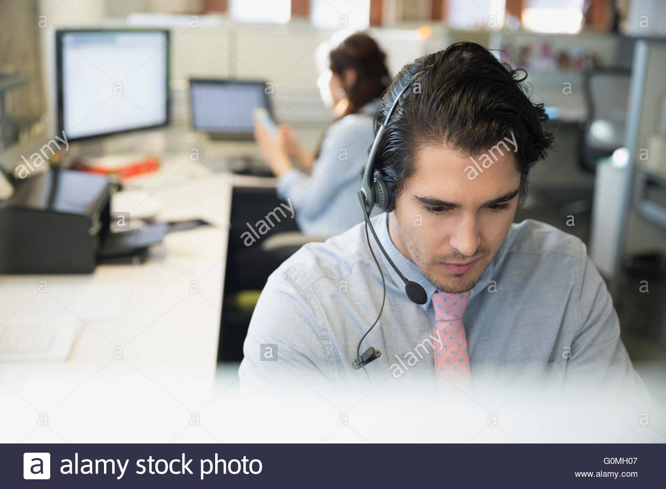 Office wearing headset hi-res stock photography and images - Alamy