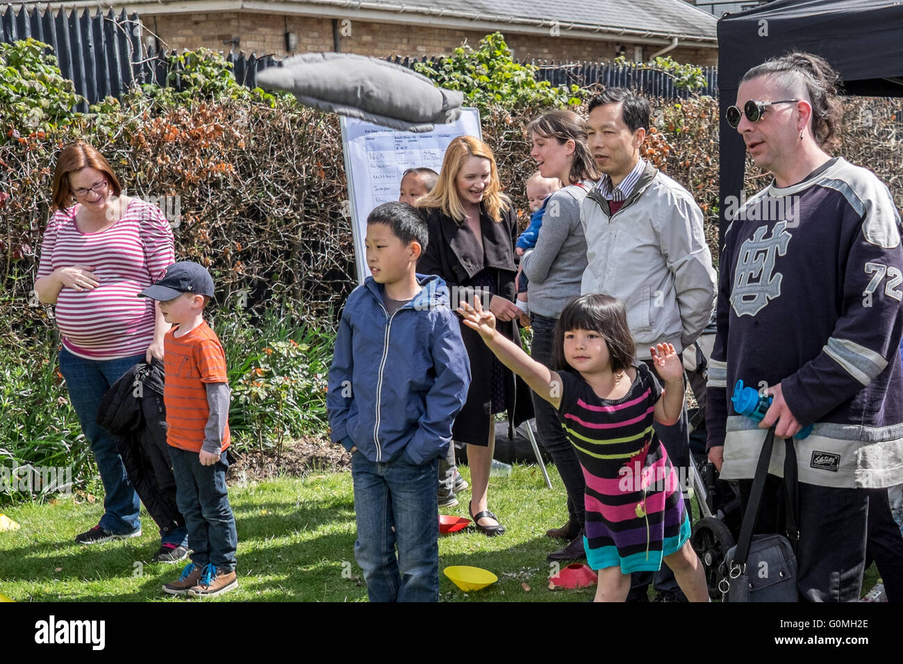 Children kids throw eels at the Ely Eel festival 2016 Stock Photo - Alamy