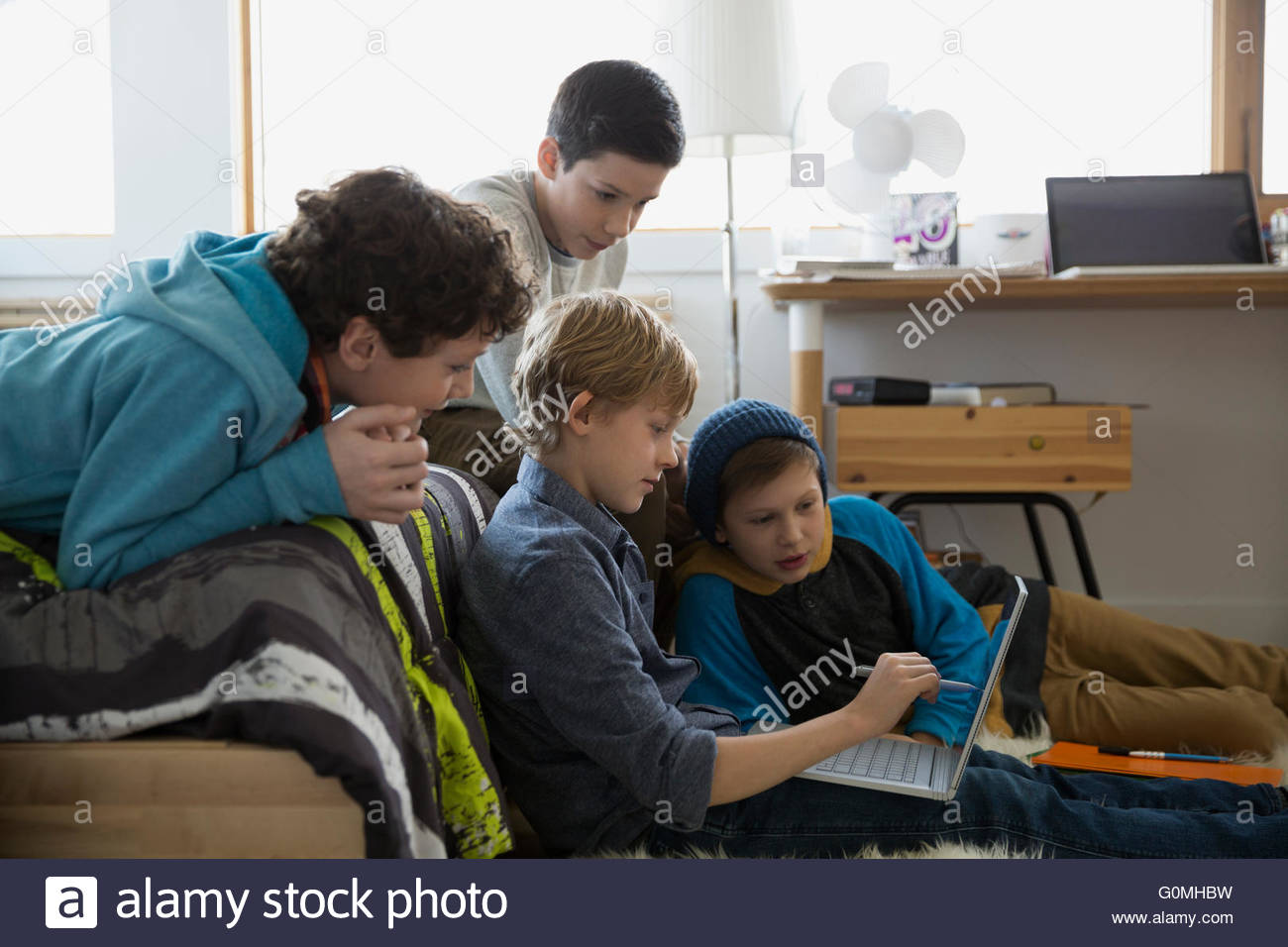 Boys with laptop hi-res stock photography and images - Alamy