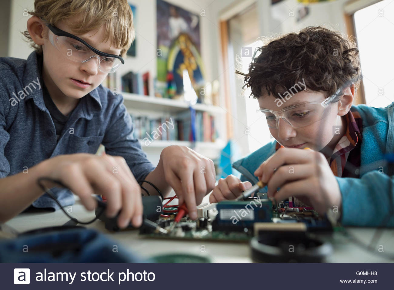 Boy disassembling hi-res stock photography and images - Alamy