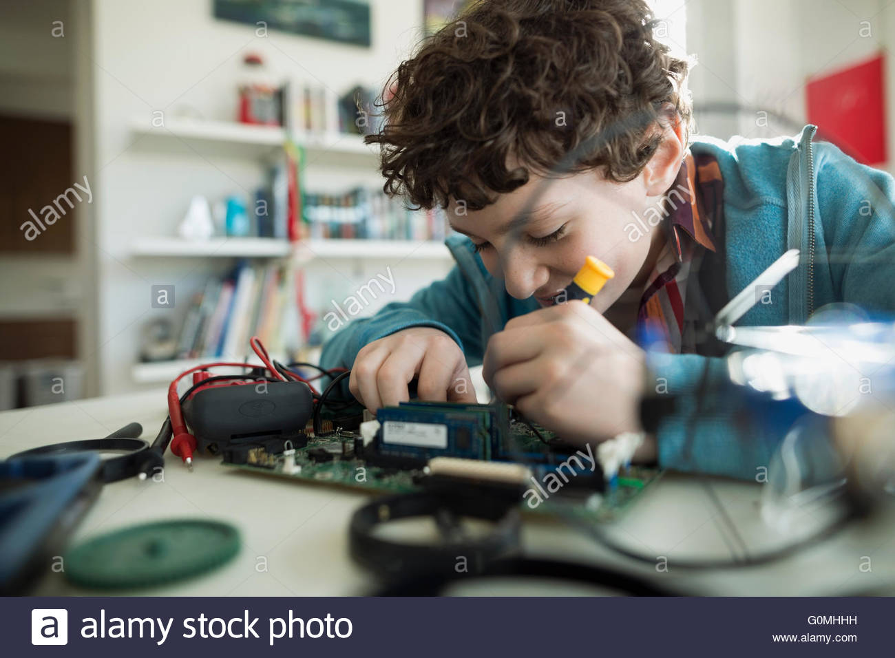 Boy disassembling hi-res stock photography and images - Alamy